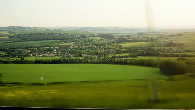 Expansive View of Lush Green Countryside with Rolling Hills Under a ...