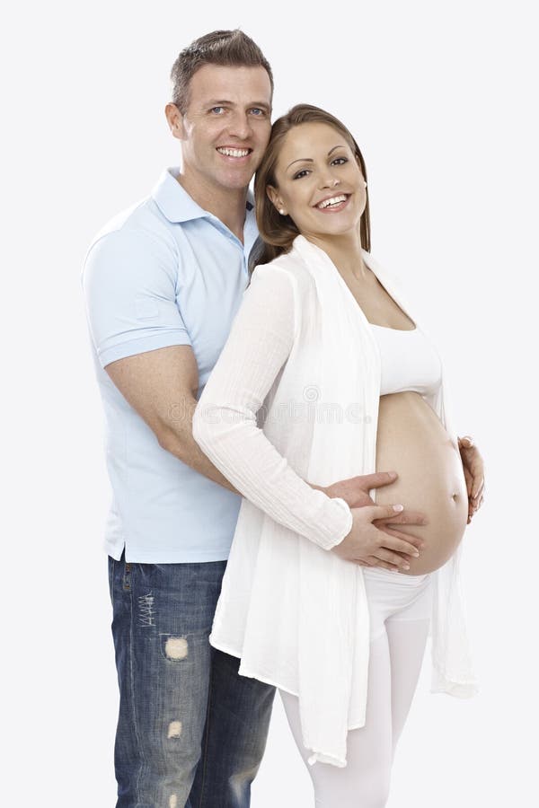 Expecting couple on sofa stock image. Image of couple - 13614793