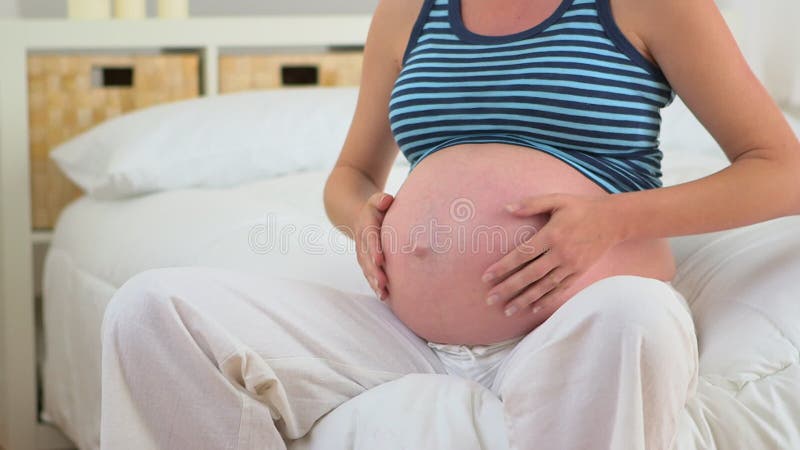 Expecting Mother Sitting on Bed Stock Footage - Video of female, young ...