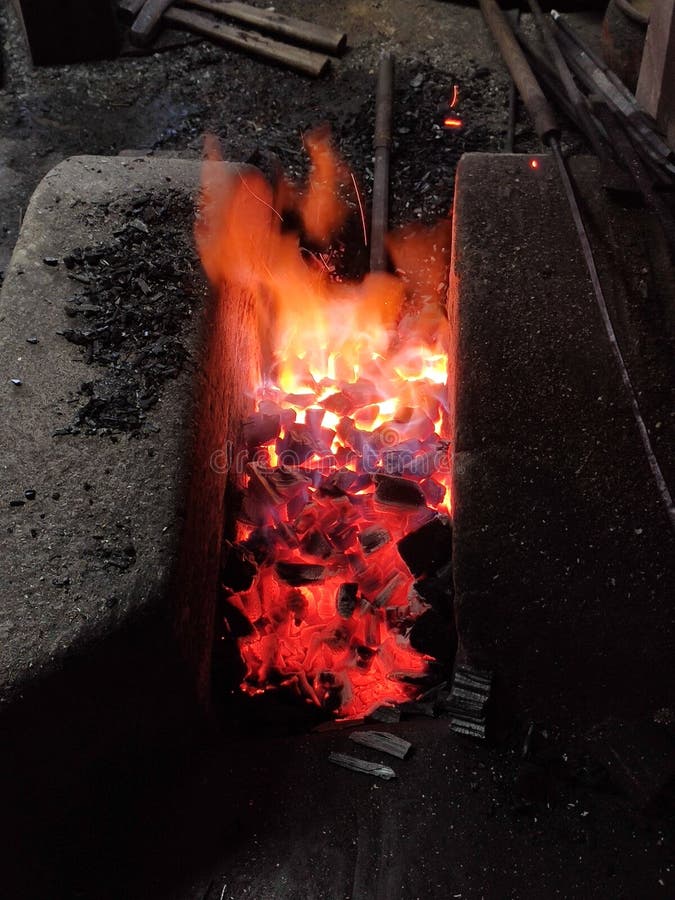 Japanese Sword Forging Workshop - Close-up of Iron Bars and Flames ...