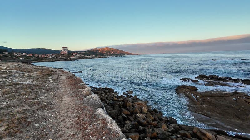 Experience a Beautiful and Serene Coastal View at Dusk, Featuring ...