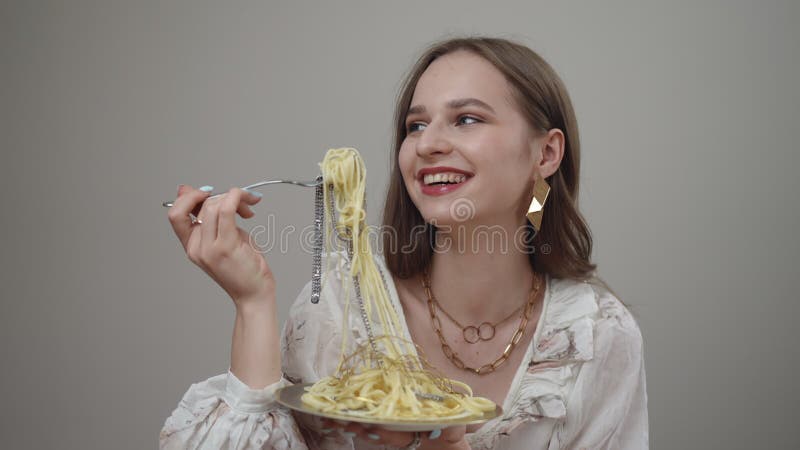 Experience a Delicious Spaghetti Meal Featuring a Charming Model in a ...