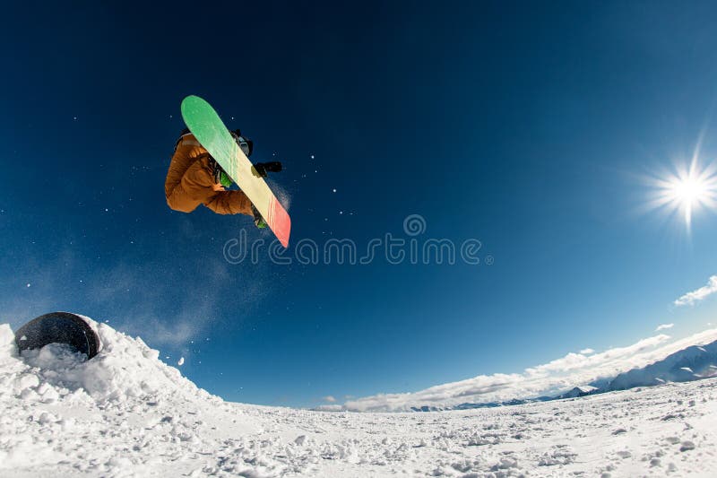 Snowboarder Springboard Jump. Height and Grace in Mid-air Maneuver ...