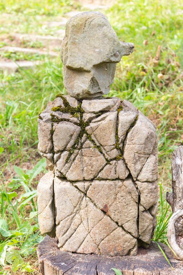 Humanoid Stone Sculpture: Garden Decor Stock Photo - Image of head ...