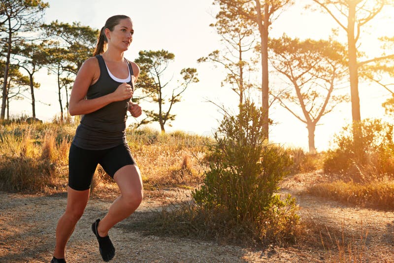 Experience Nature with a Trail Run. a Young Woman Doing a Trail Run ...