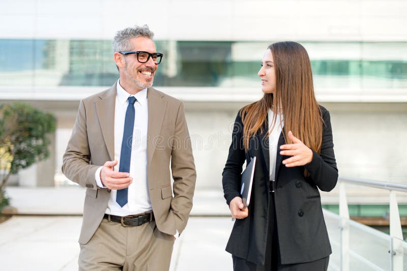 The Mature Businessman Engages in an Animated Discussion with His ...