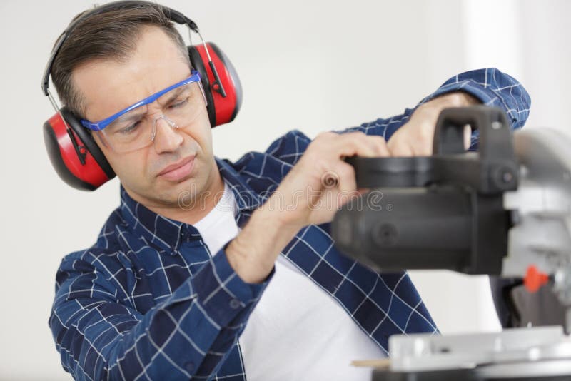 Experienced Carpenter Using Sawing Machine in Factory Stock Photo ...