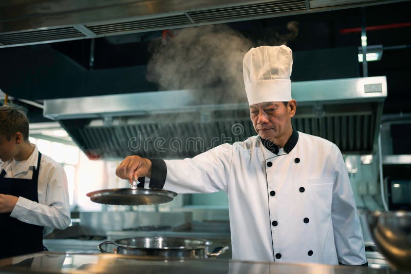 Experienced Chef Carefully Adding Corn Kernels As a Final Topping To a ...