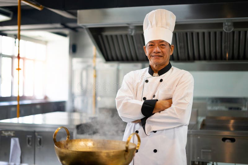 Experienced Chef is Cooking in a Large Kitchen Stock Photo - Image of ...