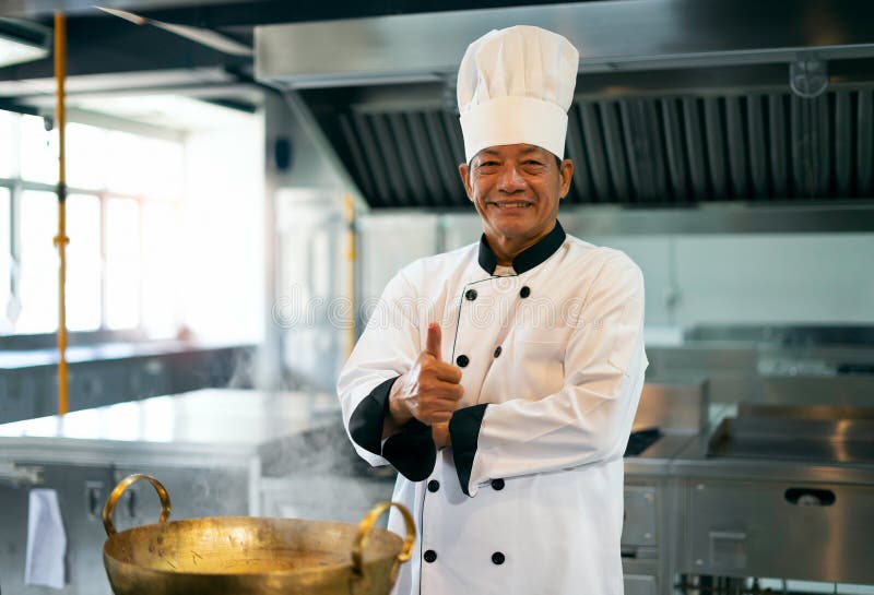 Experienced Chef is Cooking in a Large Kitchen Stock Image - Image of ...