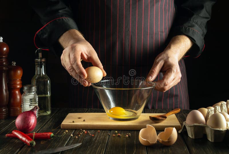 Experienced Chef Trying To Crack an Egg To Prepare a Delicious ...