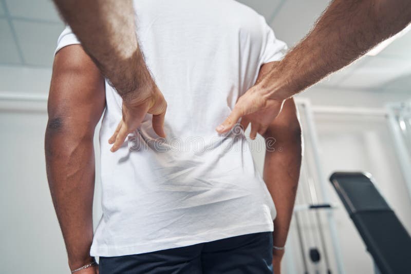 Experienced Doctor Palpating Paralumbar Muscles of Man Stock Image ...