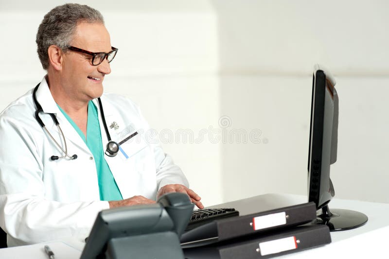 Experienced Doctor Working on Computer Stock Image - Image of ...