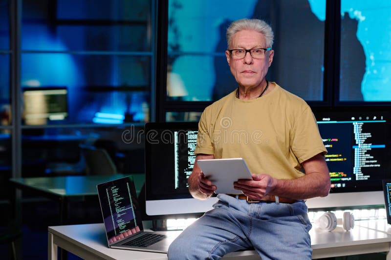 Experienced it Engineer with Grey Hair Using Tablet and Looking at ...