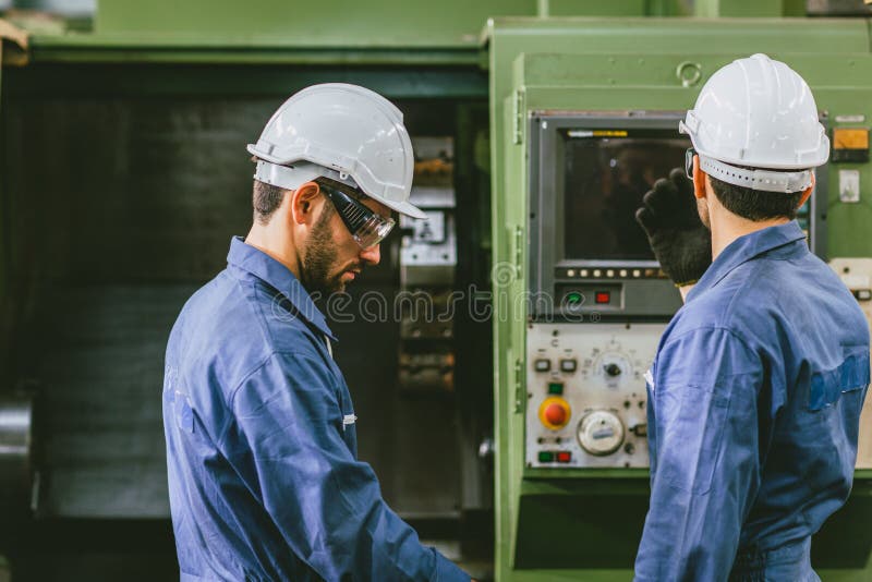 Experienced Engineer Staff Worker Working Together in Metal Factory ...