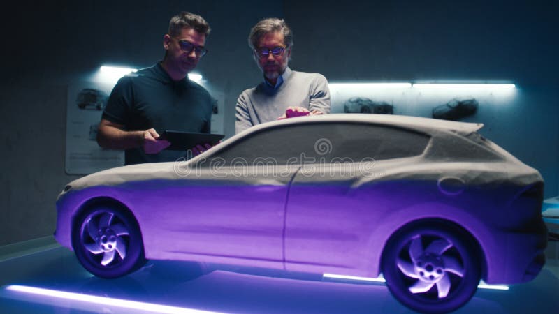 Experienced Engineers Work on Car Model Using Light Shade To Make ...