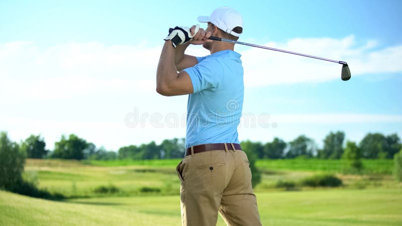 Experienced Golf Player Hitting Ball in Draw Position at Course, Back ...