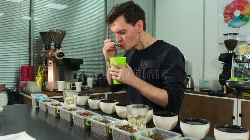 Experienced Inspector Samples Coffee by Spitting into Plastic Cup Stock ...