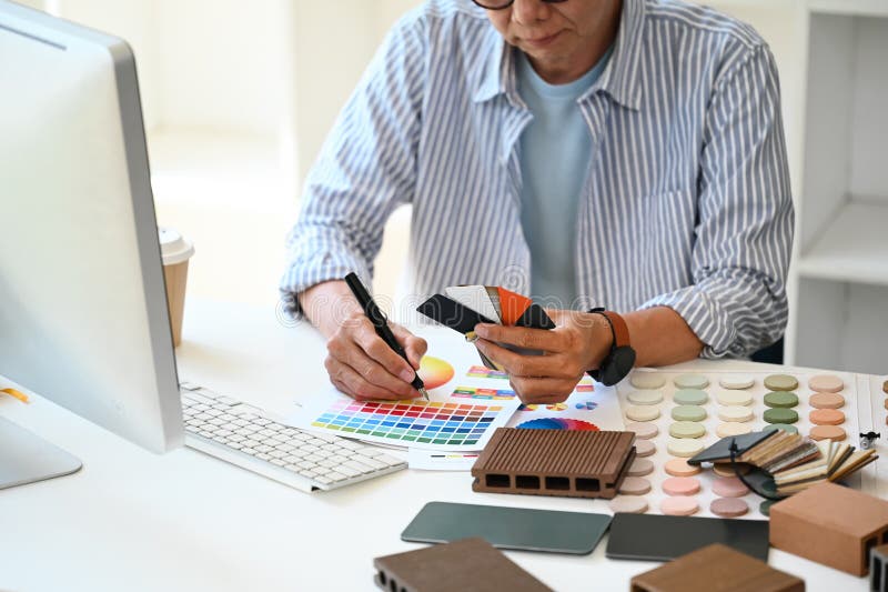 Experienced Interior Designer Choosing Paint Tone from Color Swatch ...