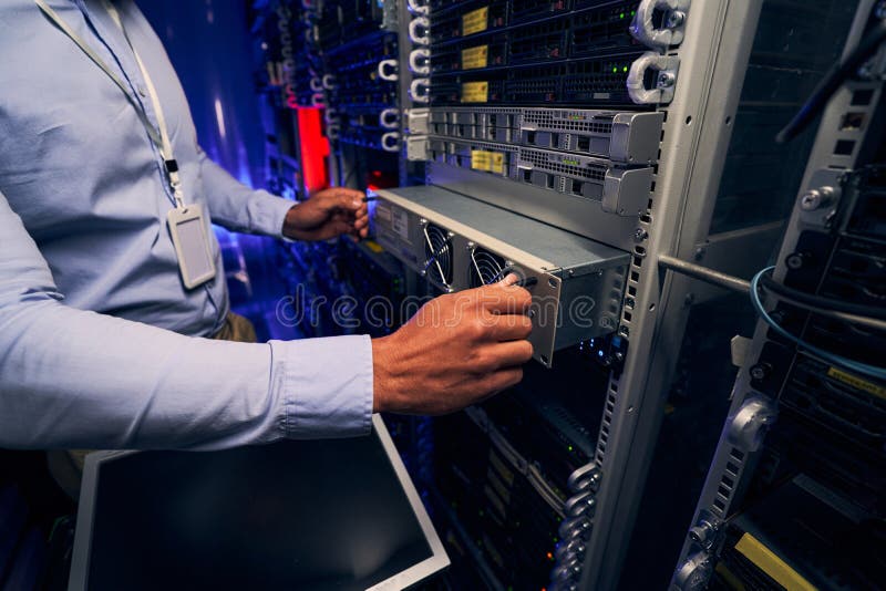 Experienced Male Engineer Replacing Network Server Components Stock ...