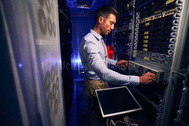 Experienced Male Engineer Working in Server Room Stock Image - Image of ...