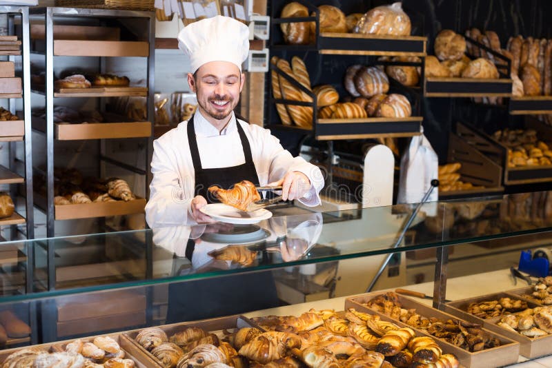 Experienced Male Pastry Maker Demonstrating Croissant Stock Image ...