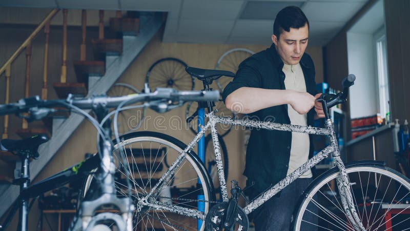 Experienced Master is Checking and Repairing Bicycle Handle-bar with ...