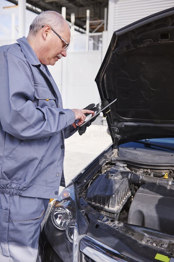 Experienced mechanic stock image. Image of expertise - 59130305