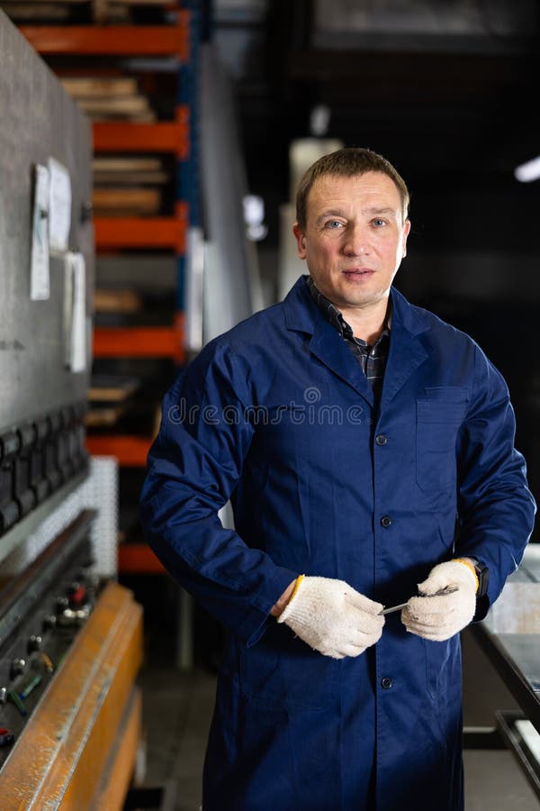 Experienced Middle-aged Worker Posing in Professional Metalworking ...