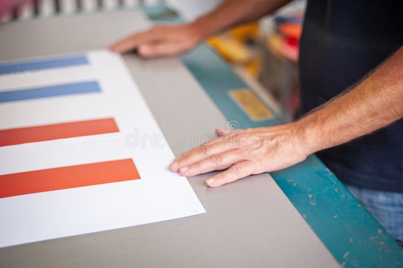 An Experienced Operator Works on a Screen Printing Machine Stock Photo ...