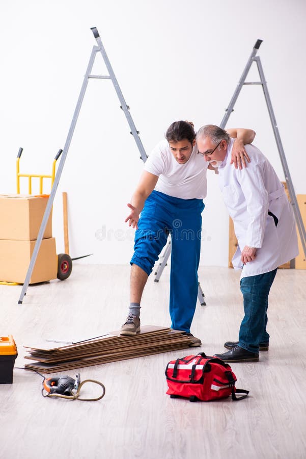 Experienced Paramedic Helping Workman Bitten by Snake Stock Photo ...