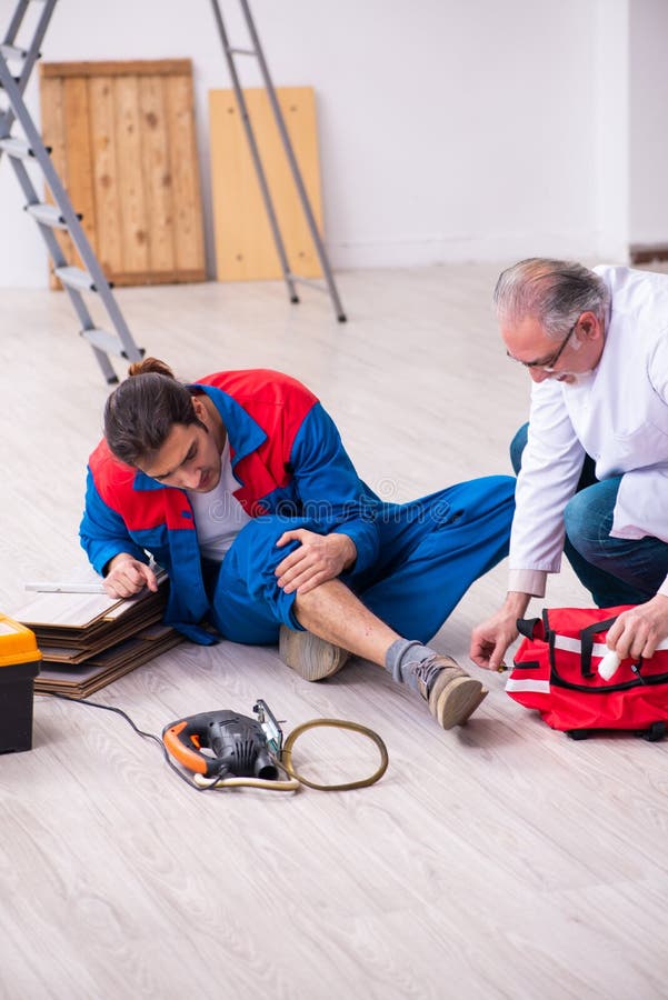 Experienced Paramedic Helping Workman Bitten by Snake Stock Photo ...