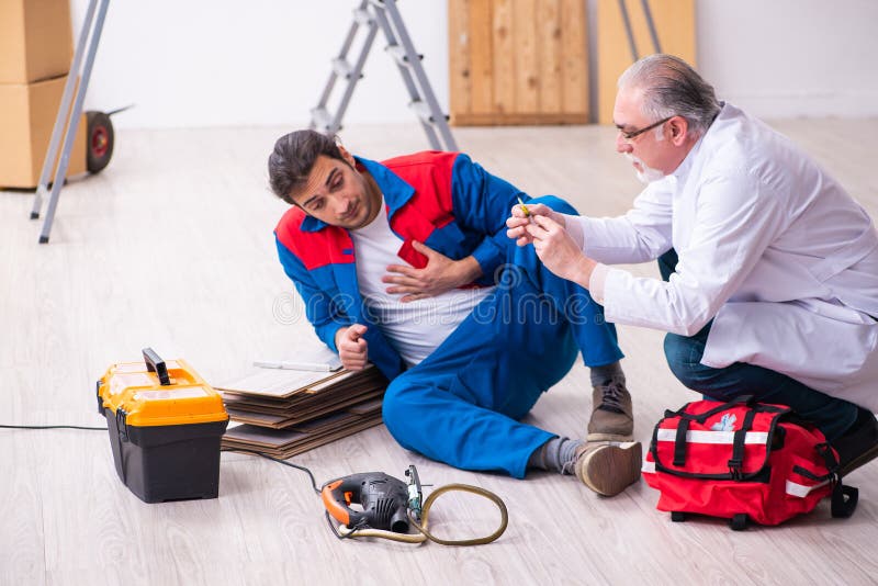Experienced Paramedic Helping Workman Bitten by Snake Stock Image ...