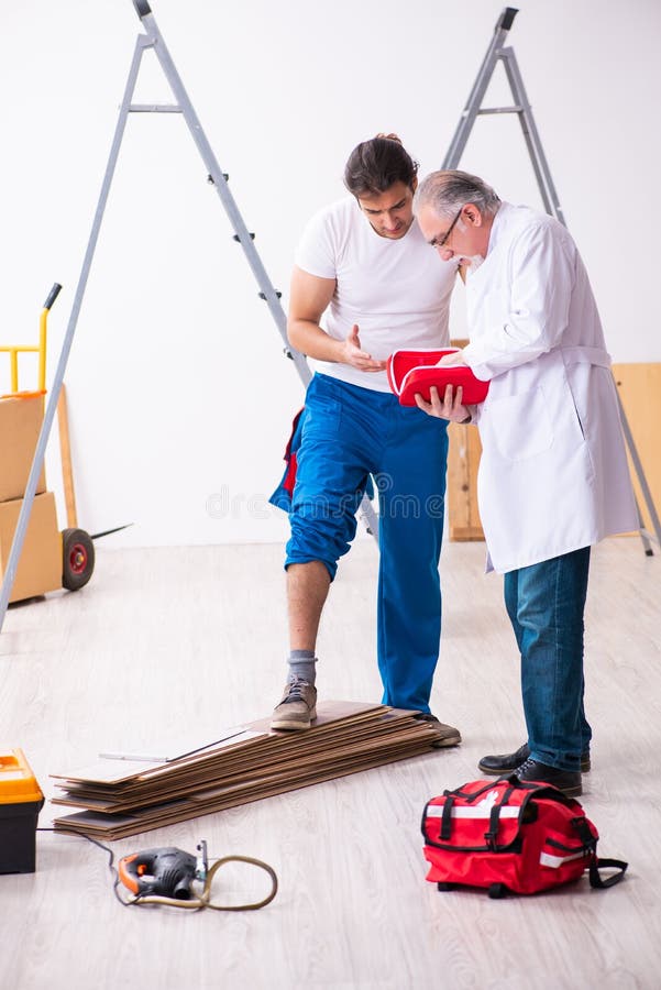 Experienced Paramedic Helping Workman Bitten by Snake Stock Photo ...