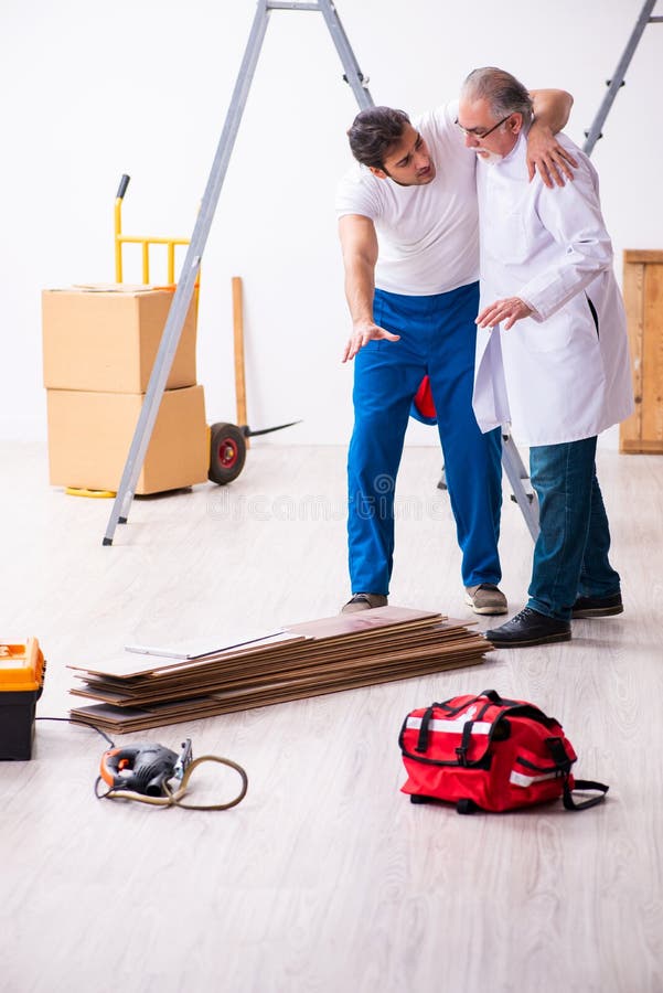 Experienced Paramedic Helping Workman Bitten by Snake Stock Photo ...