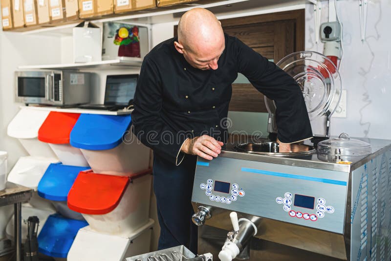 Experienced Pastry Chef Inserting Ingredients into Professional Ice ...