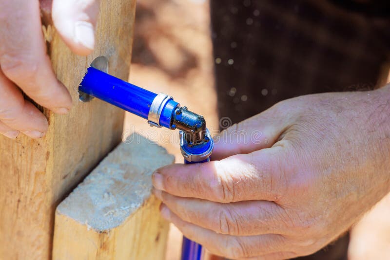 Plumber Connects Blue PVC Pipe To a Water Piping System Stock Photo ...