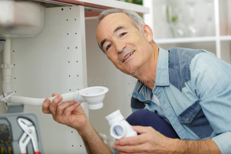 Plumbing work stock photo. Image of hold, repair, sleeves - 33939624