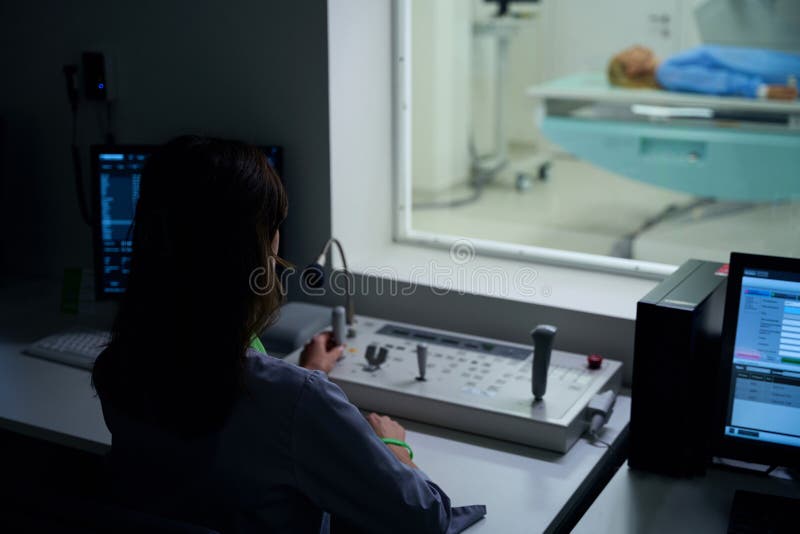 Experienced Radiologic Technologist is Performing X-ray Examination of ...