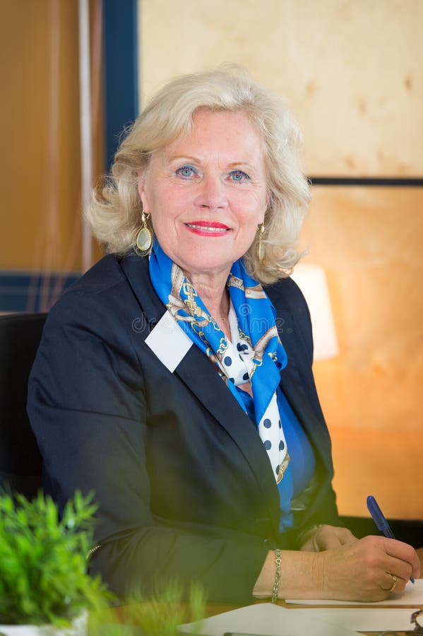 Experienced Receptionist, Writing Behind a Front Office Desk Stock ...