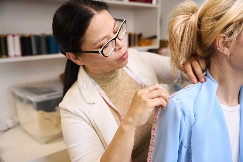 Experienced Seamstress Using Measuring Tape during Fitting Stock Image ...