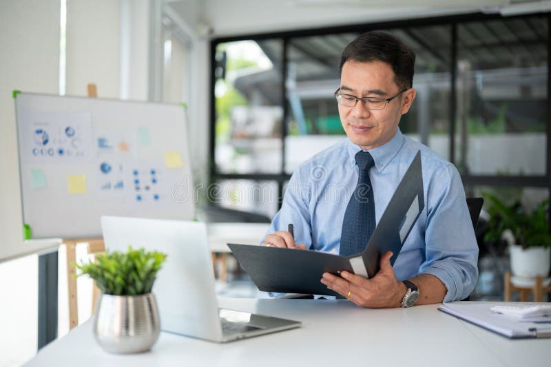 Experienced Senior Businessman Working on His Project in His Office ...