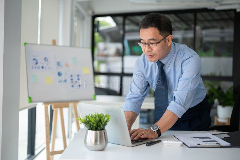 Experienced Senior Businessman Working on His Project in His Office ...