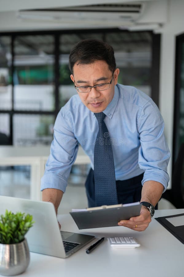 Experienced Senior Businessman Working on His Project in His Office ...