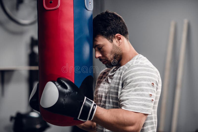 An Experienced Sportsman is Tired after an Active Boxing Training ...