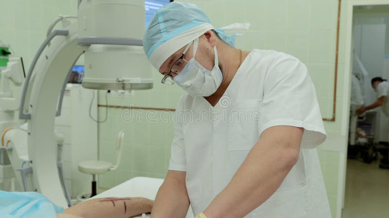 Experienced Surgeon Performing Complex Leg Surgery, Using Cutting Edge ...
