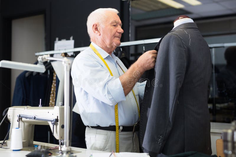 Experienced Tailor Threading Jacket before Starting Work in Workshop ...