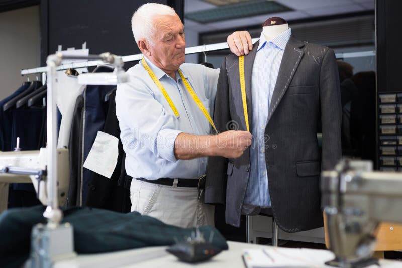 Experienced Tailor Threading Jacket before Starting Work in Workshop ...