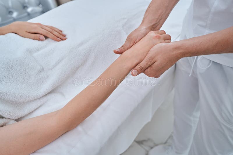 Experienced Therapist Giving A Hand Massage To A Patient Stock Image