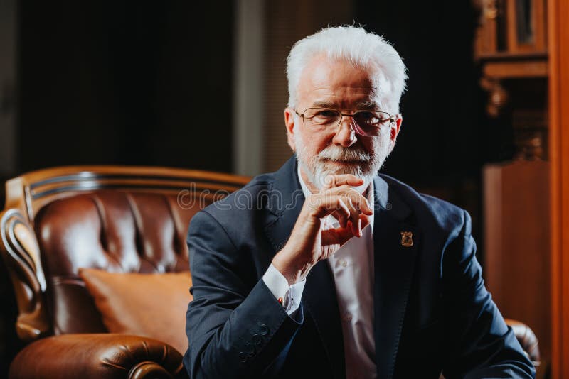 Experienced University Rector Posing Confidently in Modern Office. Copy ...